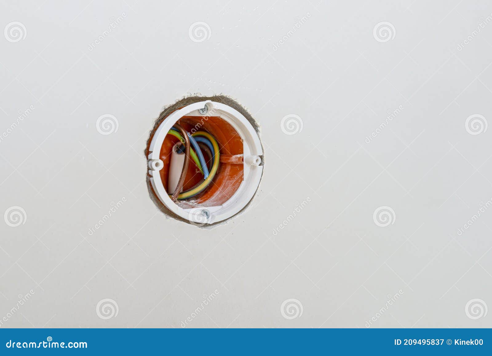 Orange, Round Installation Box Mounted in a White Wall with an ...