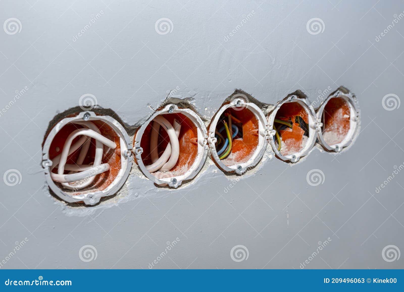 Orange, Round Installation Box Mounted in a White Wall with an ...