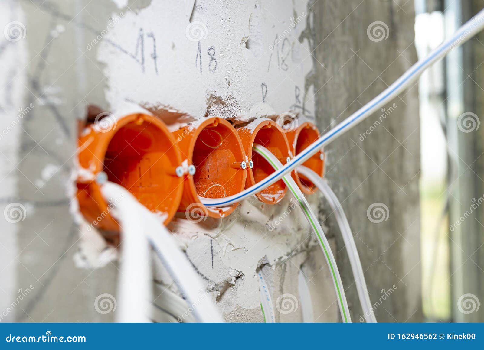 Orange, Round Junction Box Mounted in the White Wall with Protruding ...