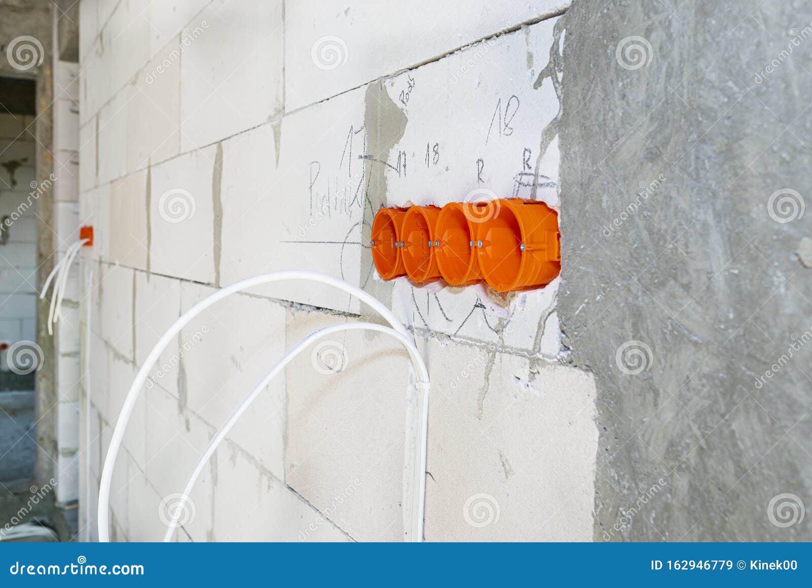 Orange, Round Junction Box Mounted in the White Wall with Protruding ...