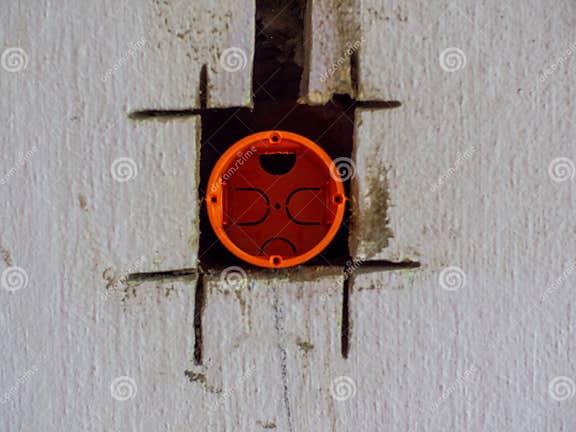 Plastic Backbox for Socket or Switch Inserted into the Drilled Hole on ...