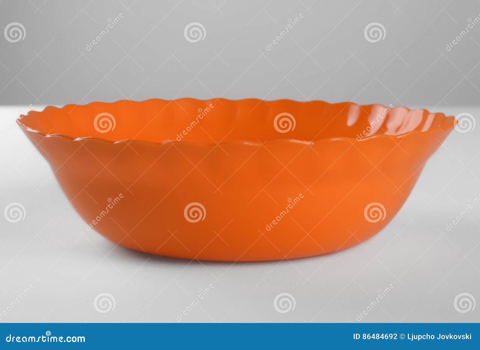 Orange Round Plastic Deep Dish Stock Photo - Image of dish, color: 86484692
