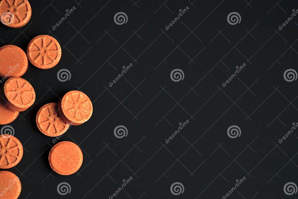 Orange Round Orange Shaped Tablets are Scattered Chaotically on a Left ...