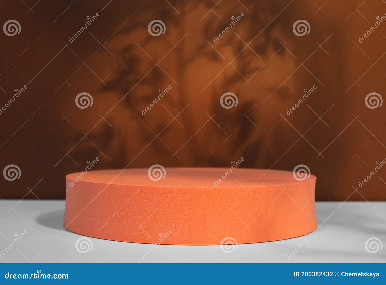 Orange Round Stand on White Table. Stylish Presentation for Product ...