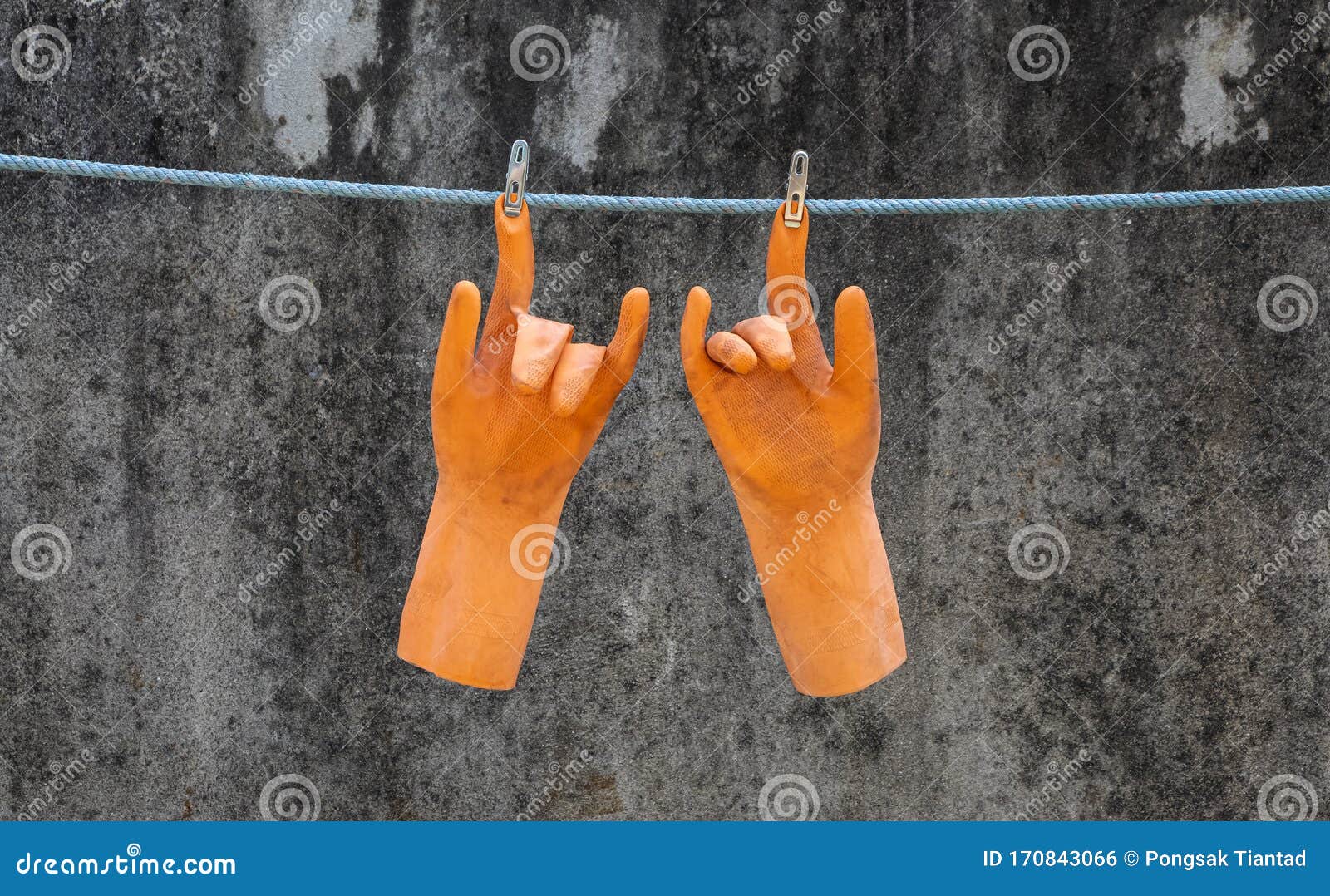 The Orange Rubber Gloves are Hanging on the Plastic String Stock Photo ...