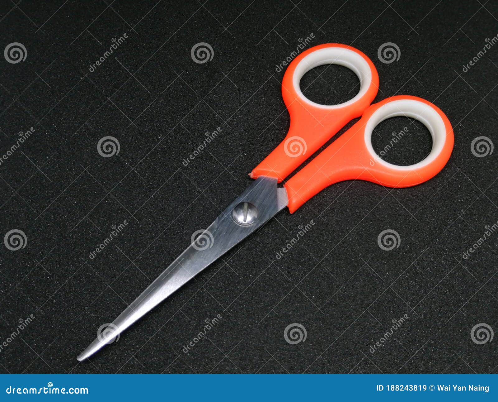 Orange Scissors on Black Background in Studio Light Stock Image - Image ...