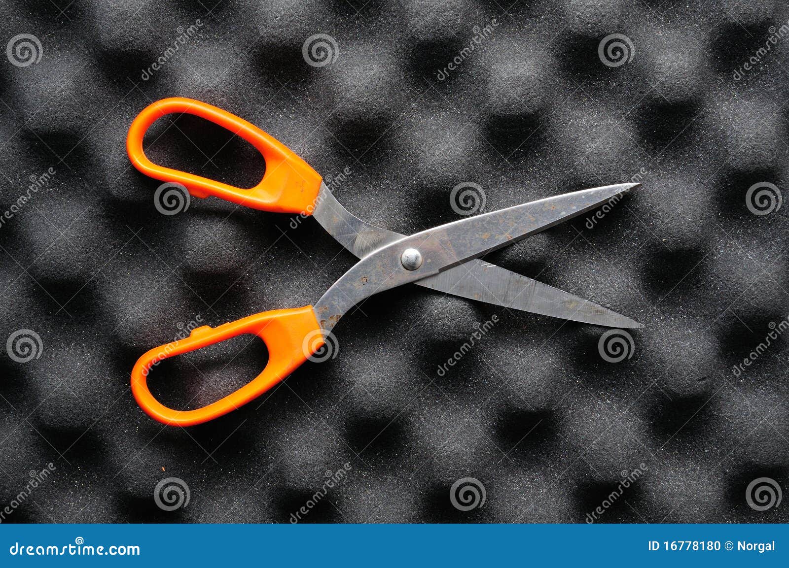 Orange scissors on sponge stock photo. Image of texture - 16778180
