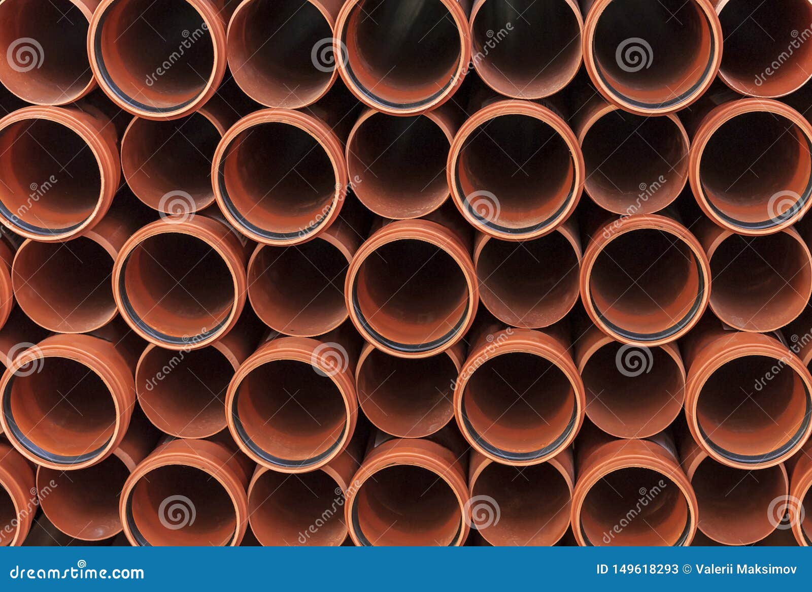 Orange Sewer Pipes In The Underground Parking Lot For Residents Of A ...