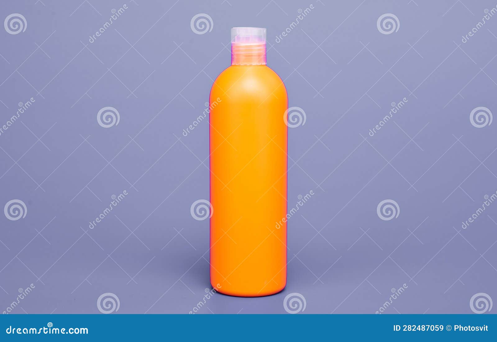 Orange Shampoo Bottle on Blue Background, Cosmetology Stock Image ...