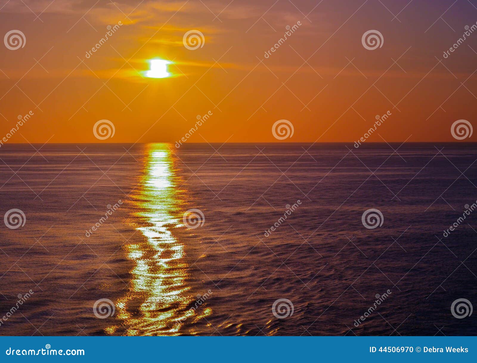 Orange Skies with Sun Setting Over the Ocean Stock Photo - Image of ...