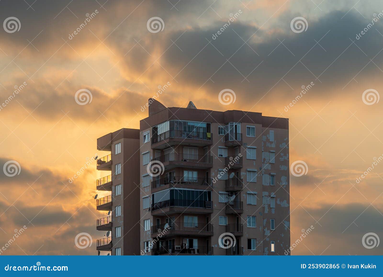 Orange Sky at Sunset, a High-rise Building and the Sun Behind Them ...