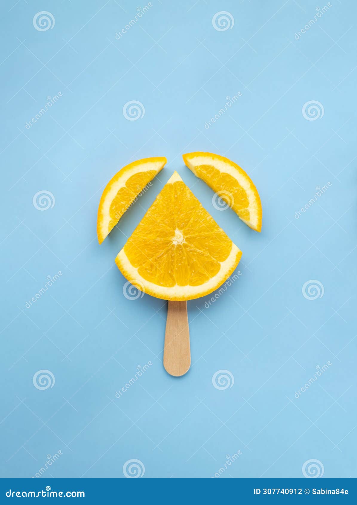 Orange Slice As Ice Cream, Orange on a Stick, Blue Background Stock ...