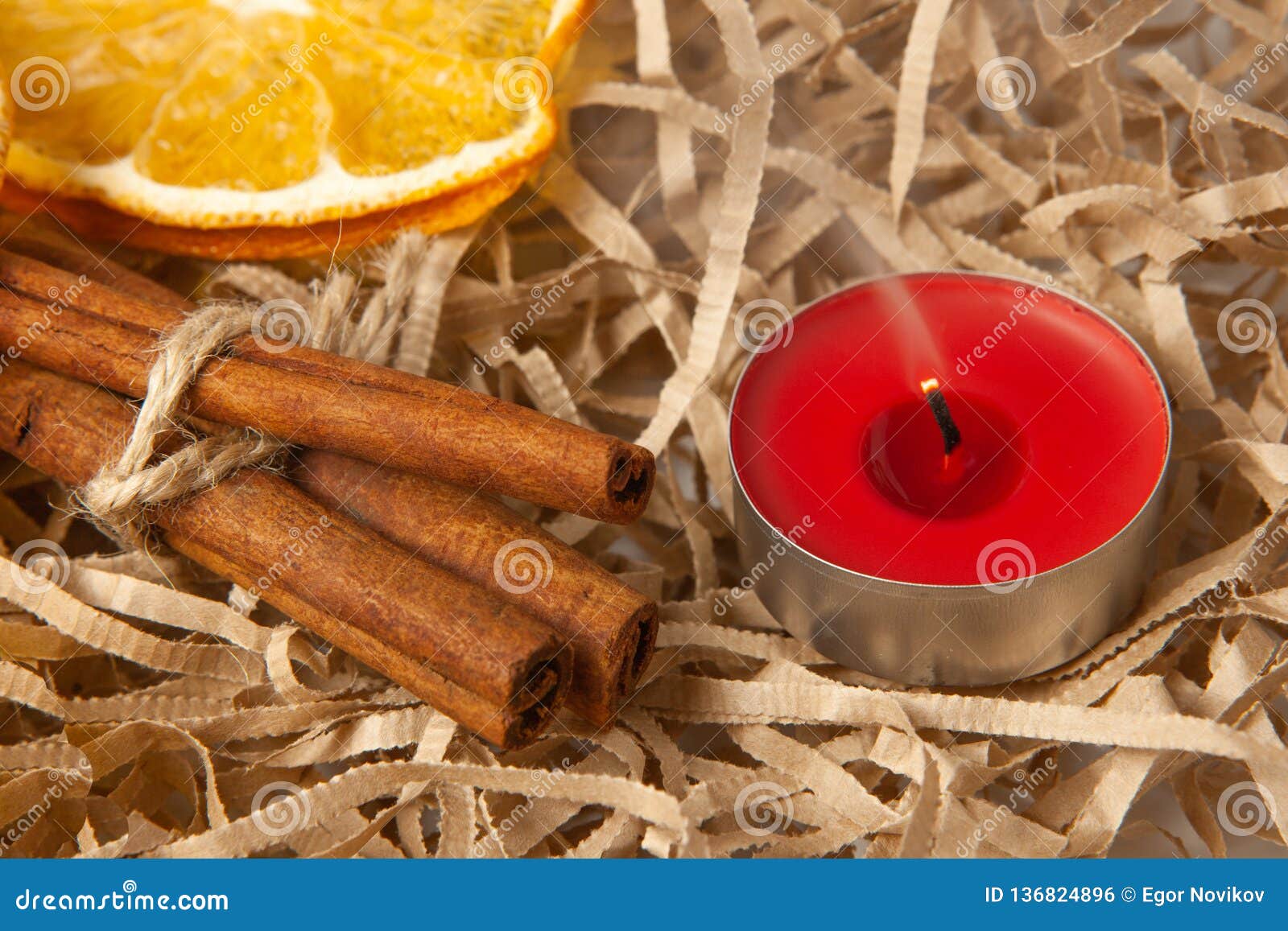 Orange Slice and Fragrant Cinnamon Sticks with a Red Extinguished ...