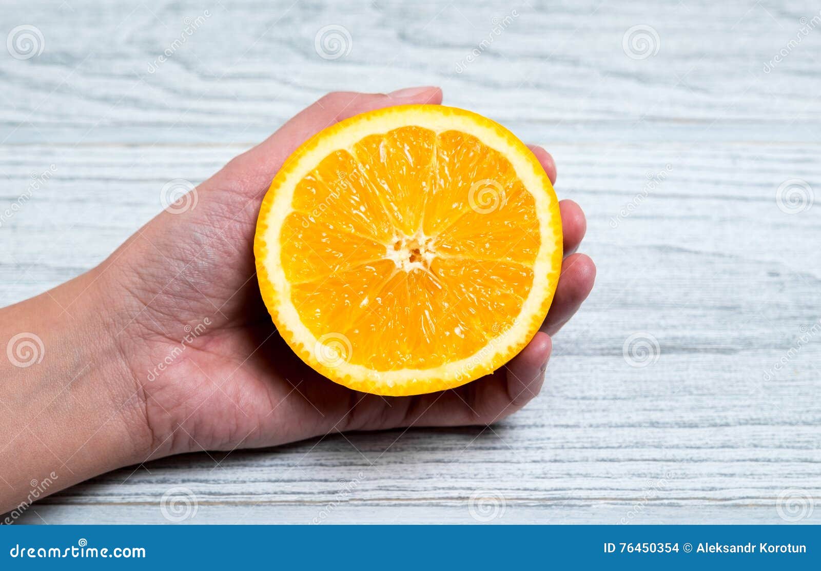 Orange sliced on a hand stock photo. Image of diet, healthy - 76450354