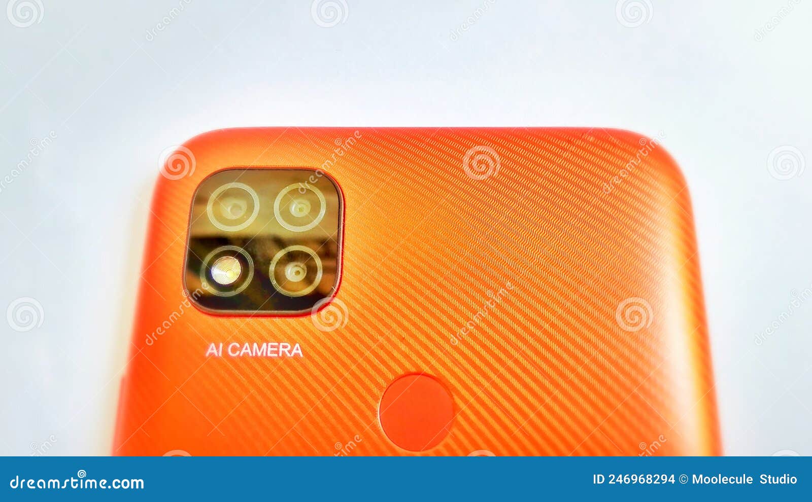Orange Smartphone with Artificial Intelligence (AI) Cameras Under White ...