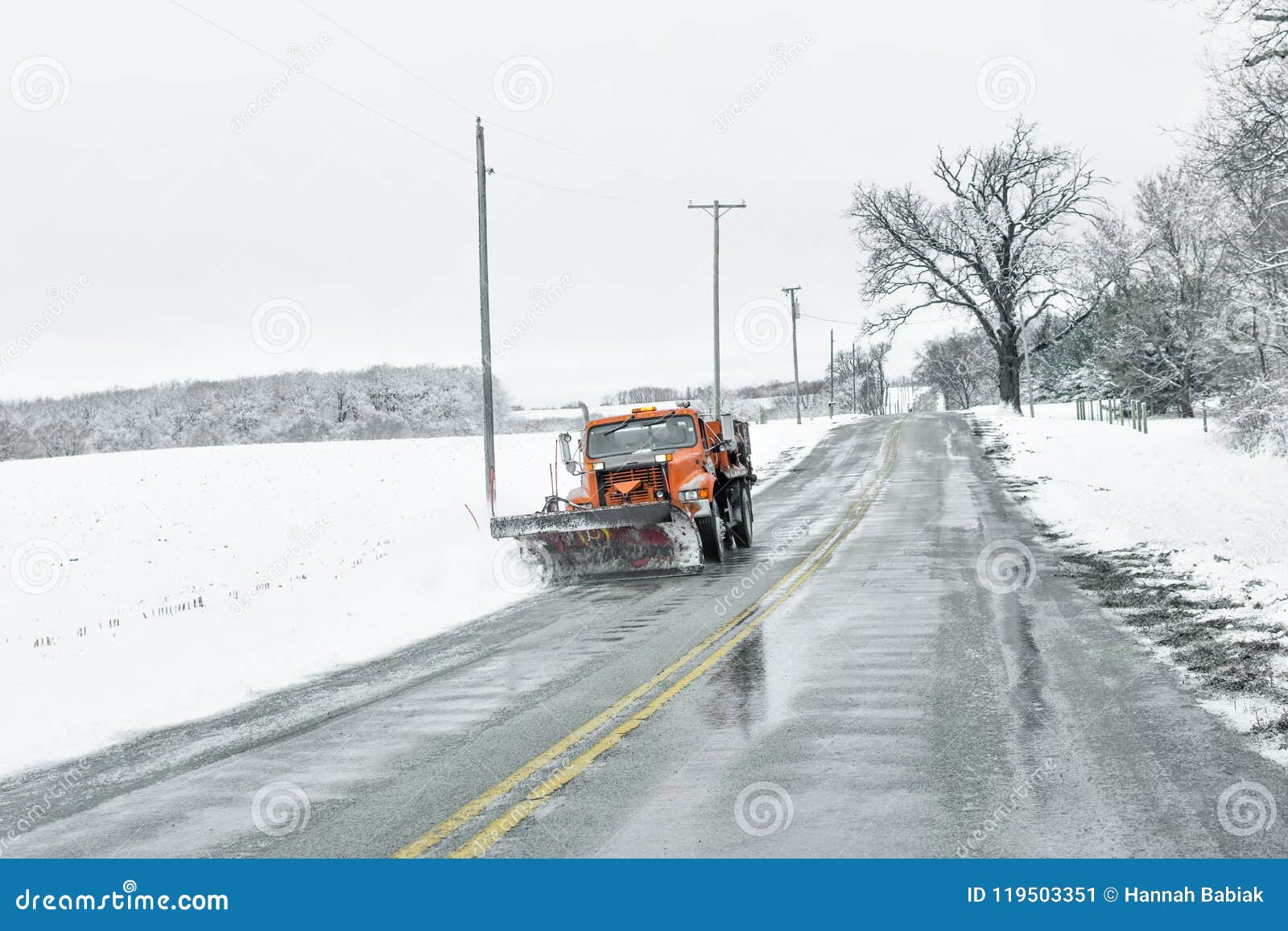 Snow Plow Truck Clearing Icy Road After Winter Snowstorm Blizzard For ... Snow Plow Truck Clearing Icy Road After Winter Snowstorm Blizzard For ...