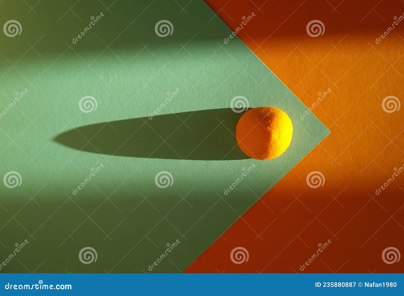 Orange Spherical Candy in the Rays of the Sun on a Turquoise Orange ...