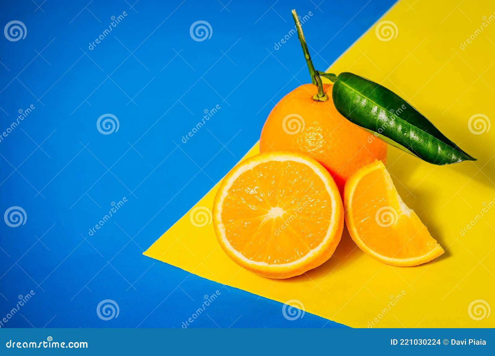 A Whole Orange Split in Half Stock Photo - Image of yellow, slice ...