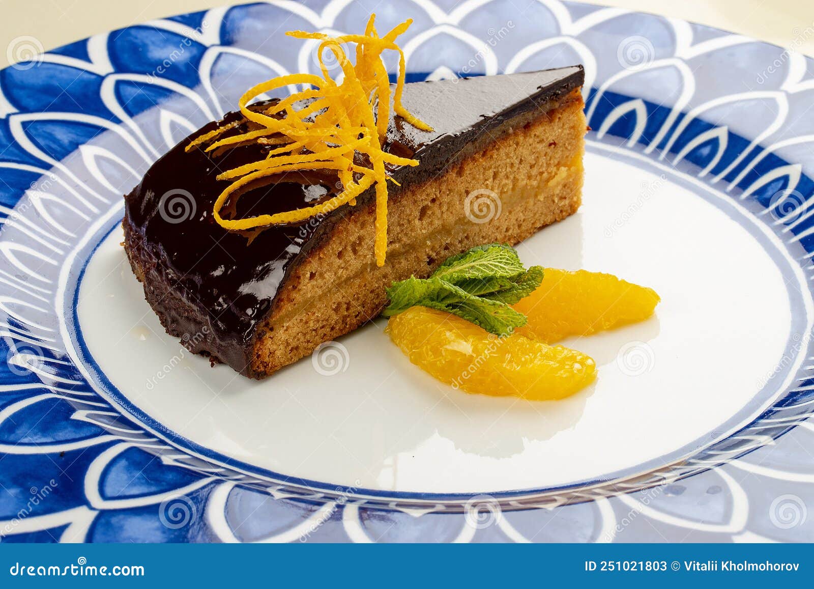 Orange, Sponge Cake Under Chocolate Frosting. on a White Background ...