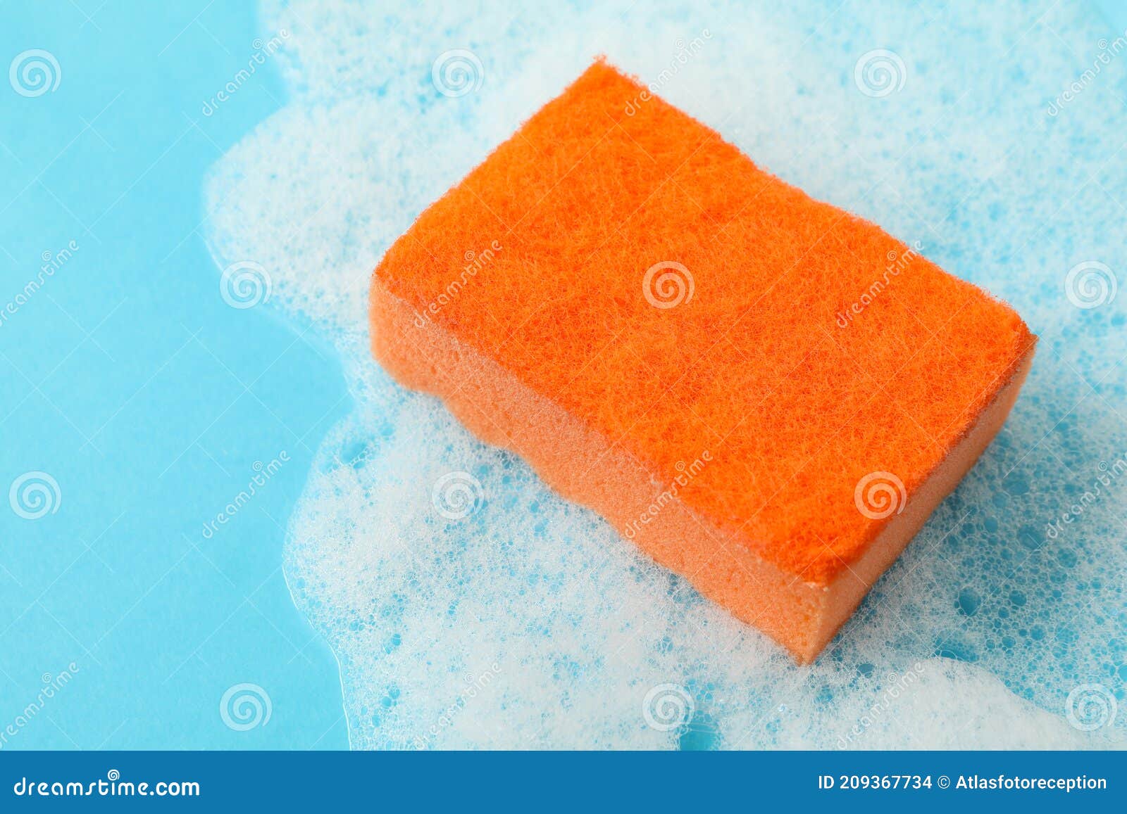 Orange Sponge and Foam on Blue Background Stock Photo - Image of foam ...