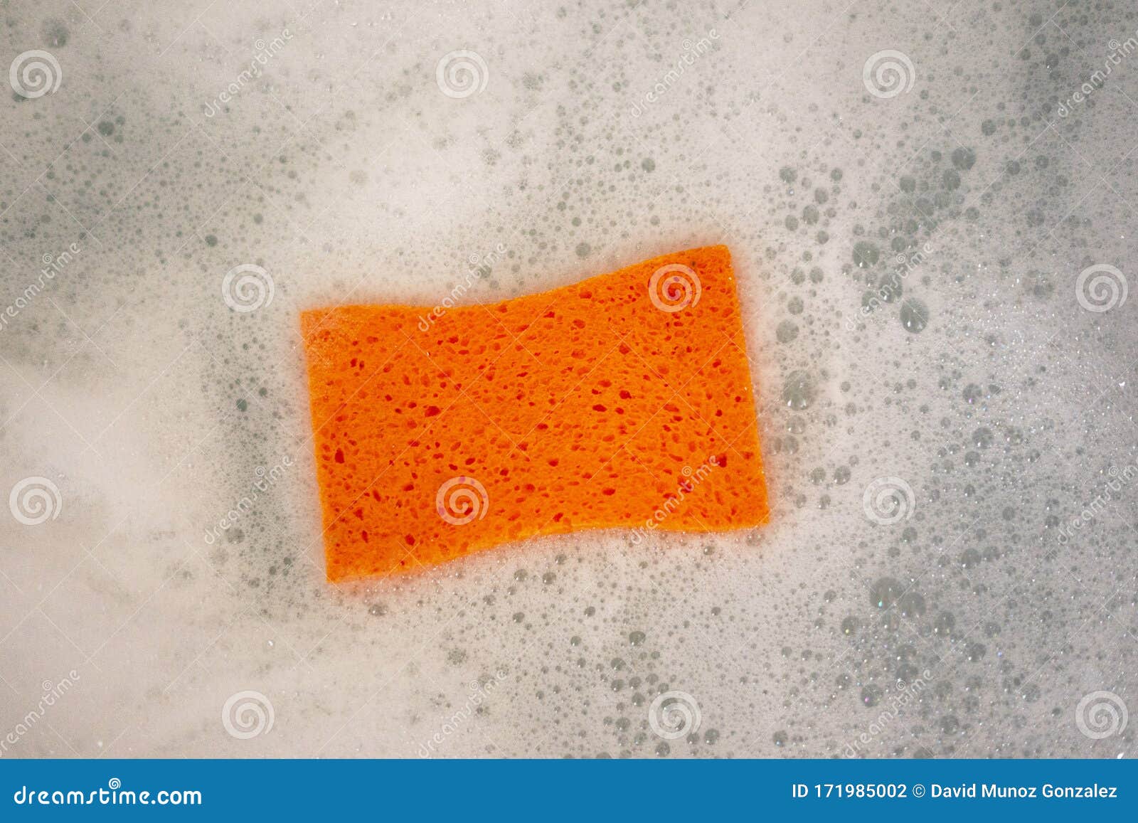 Orange Sponge Inside the Bathtub with Soap and Water Stock Photo ...