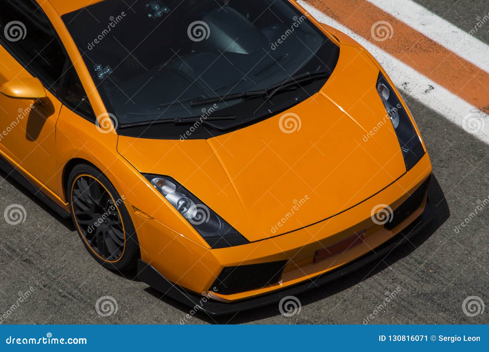Orange sport race car editorial photo. Image of asphalt - 130816071