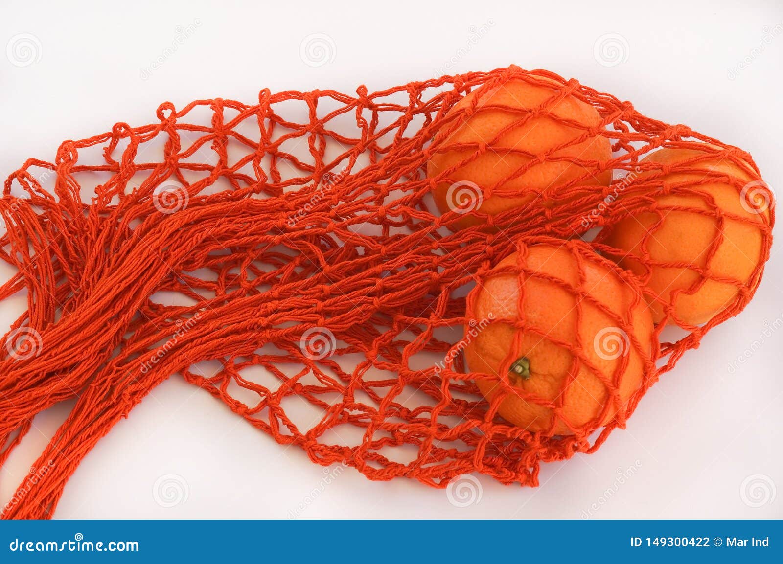 Orange string bag stock photo. Image of background, hand - 149300422