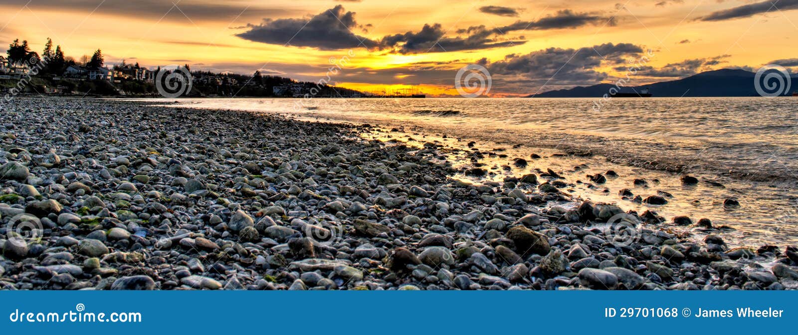 Panoramic Pebble Beach with Orange Sunset Stock Photo - Image of ...