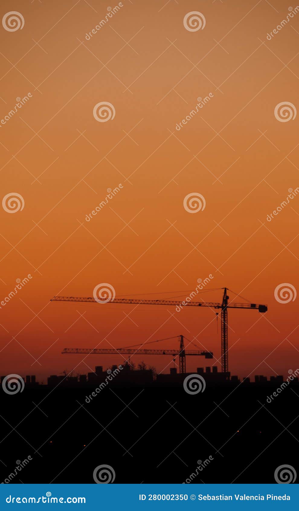 Orange Sunset with Construction Cranes Stock Photo - Image of ...