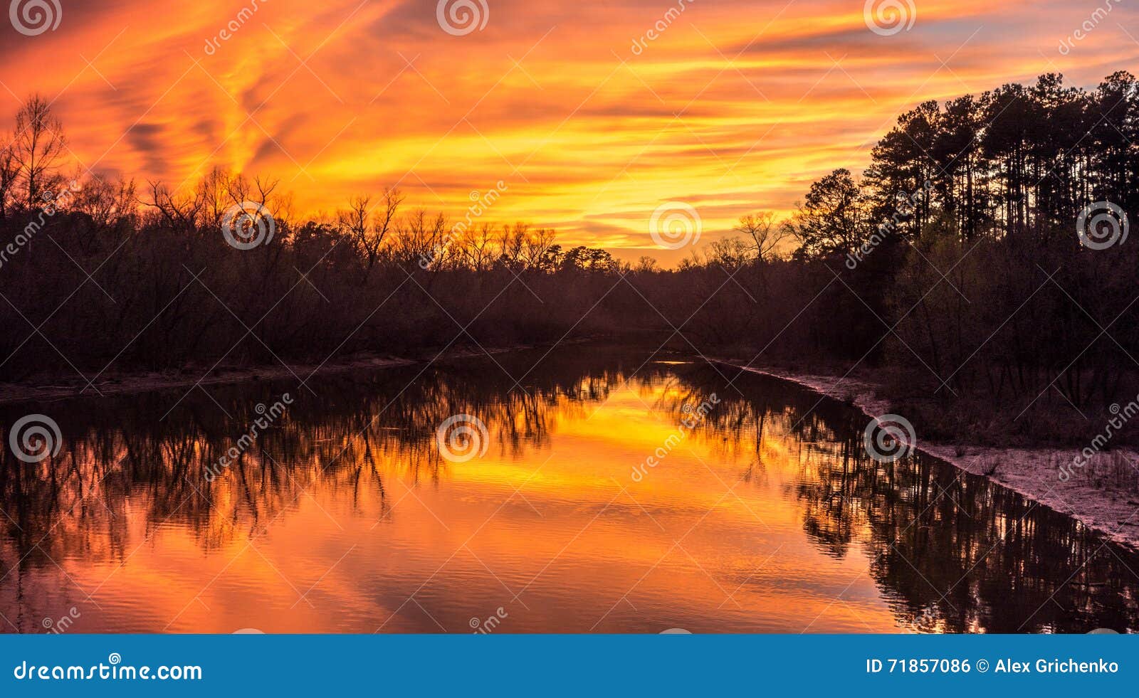 Orange sunset over lake stock photo. Image of mirror - 71857086
