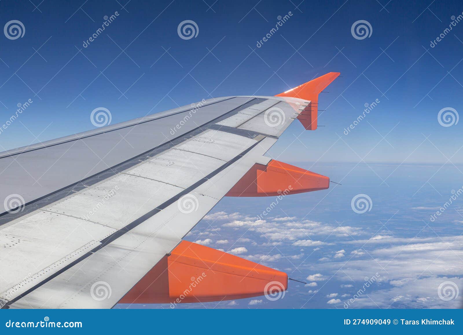 Orange-tailed Airplane Wing Soaring through the Sky Stock Image - Image ...