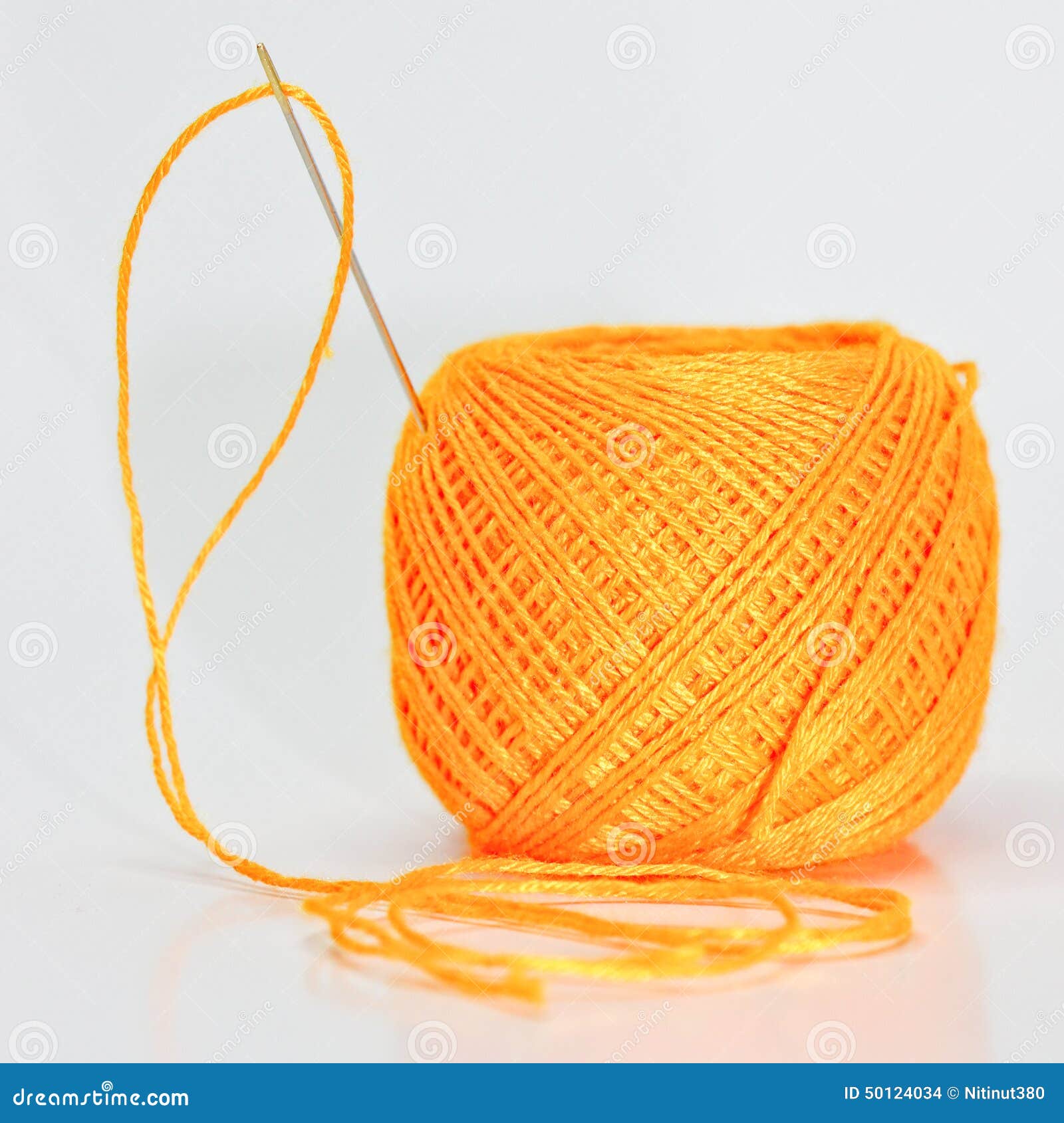 Orange thread and needle stock photo. Image of cotton - 50124034
