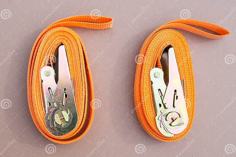 Orange Tie-down Straps for Securing the Load, Rolled into a Roll on the ...