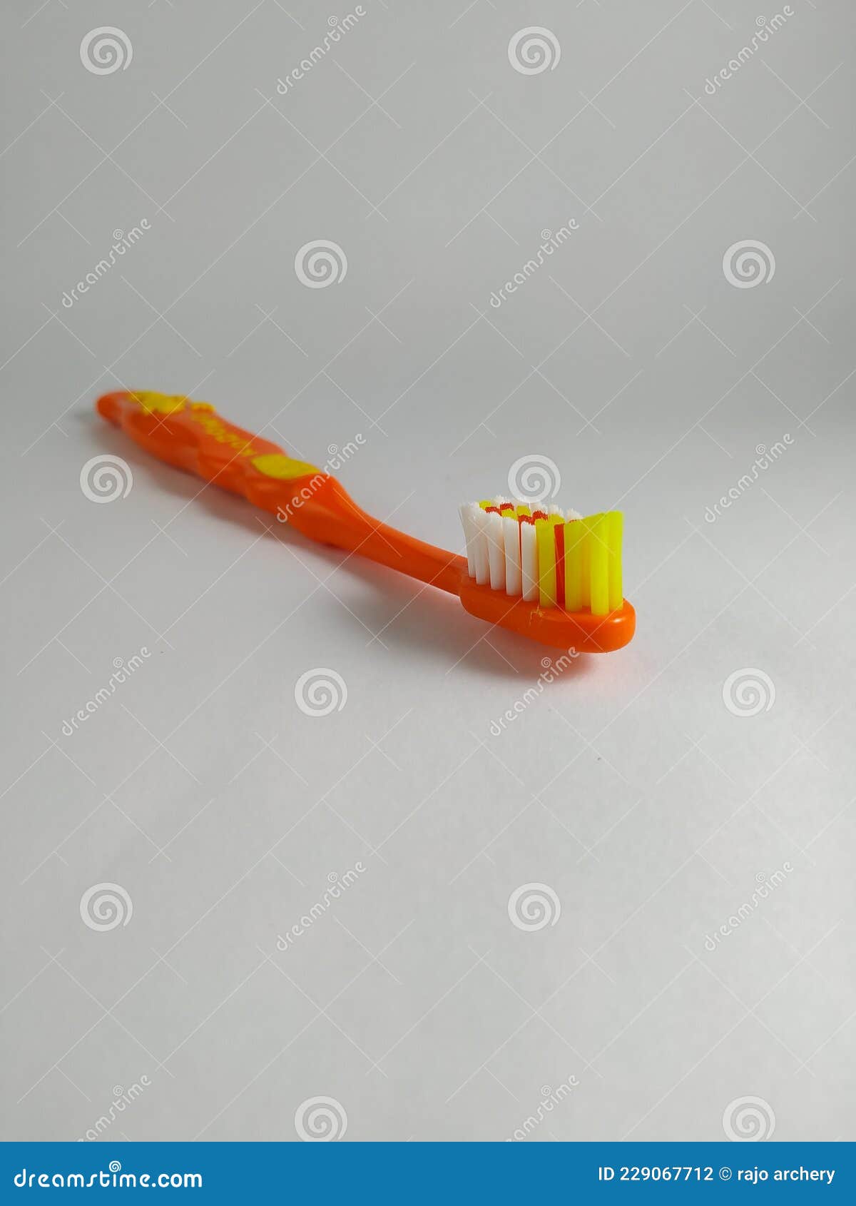 An orange toothbrush stock photo. Image of wood, wing - 229067712