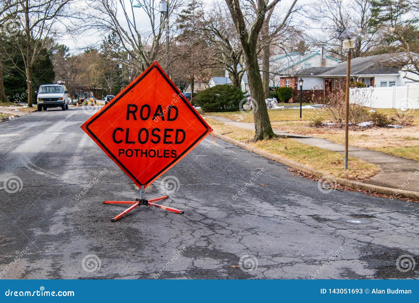 Orange Triangular Road Sign on a Small Suburban Street that Says Road ...