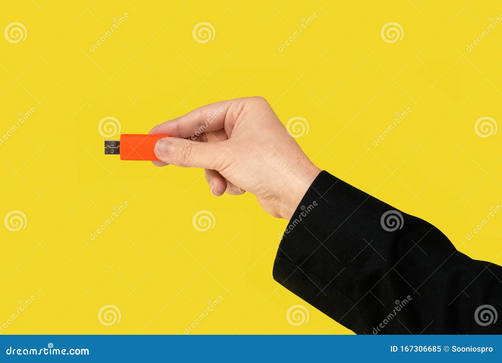 Orange USB Memory Stick on Hand with Yellow Background Stock Image ...
