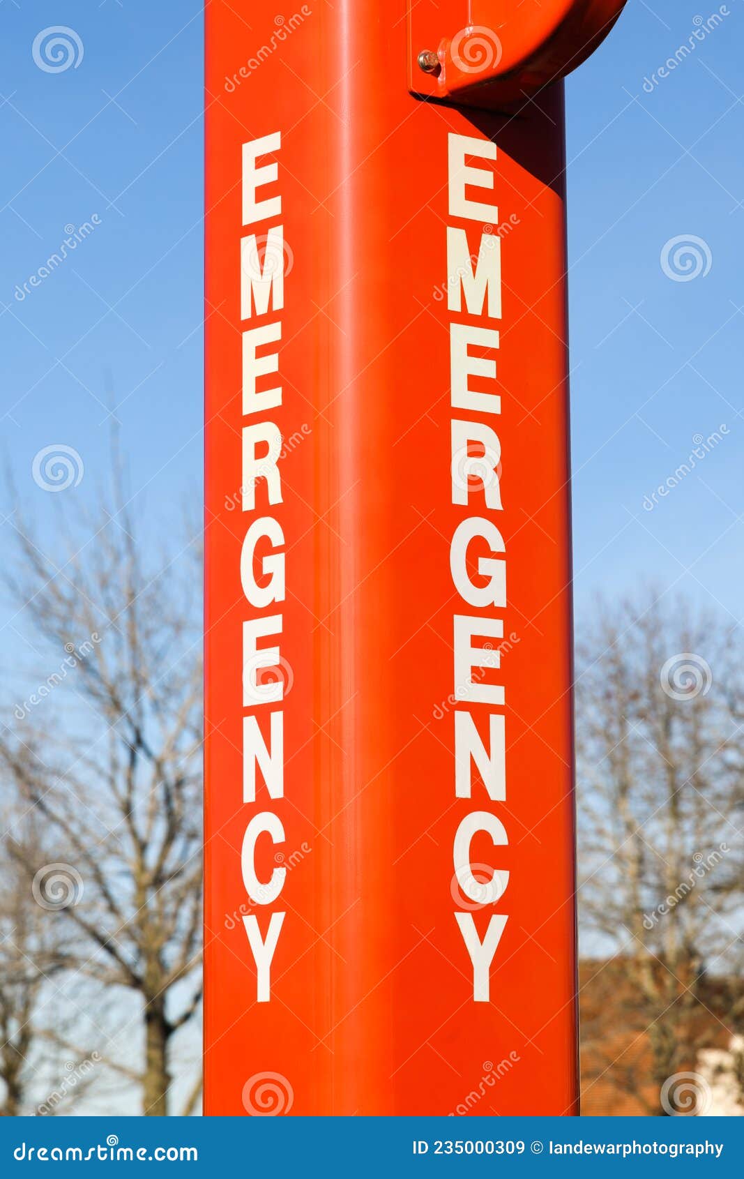 Orange Vertical Post with the Word Emergency in White on Each Side ...