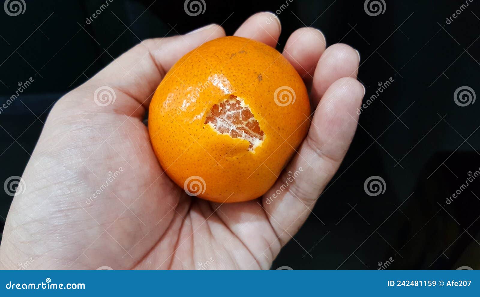 Orange was bitten by child stock image. Image of meal - 242481159