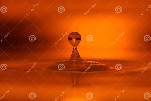 Orange water drop stock image. Image of light, moment, drip - 25799