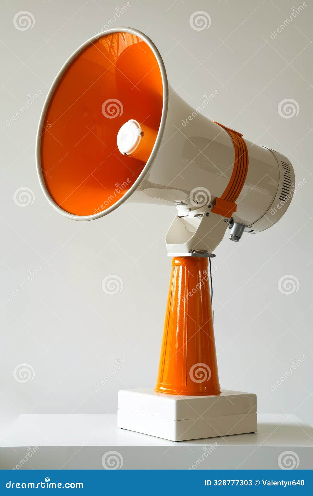 An Orange and White Megaphone Sitting on Top of a White Table ...