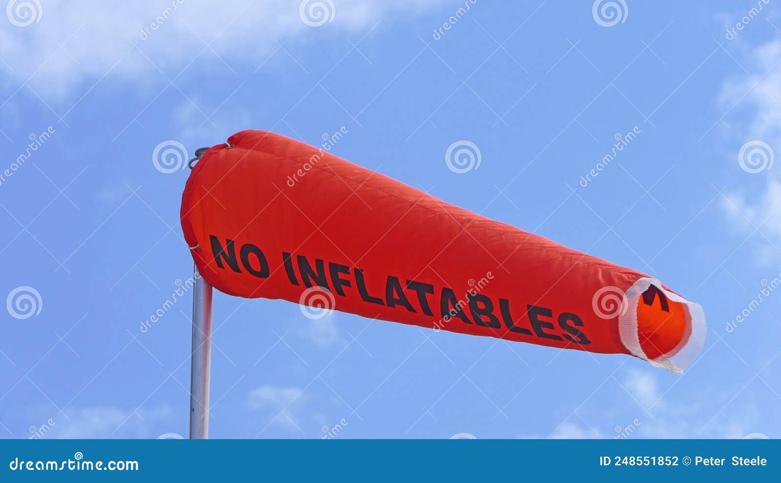 Orange Windsock and Beach Warning Flags Indicating Sea Hazard on Sandy ...