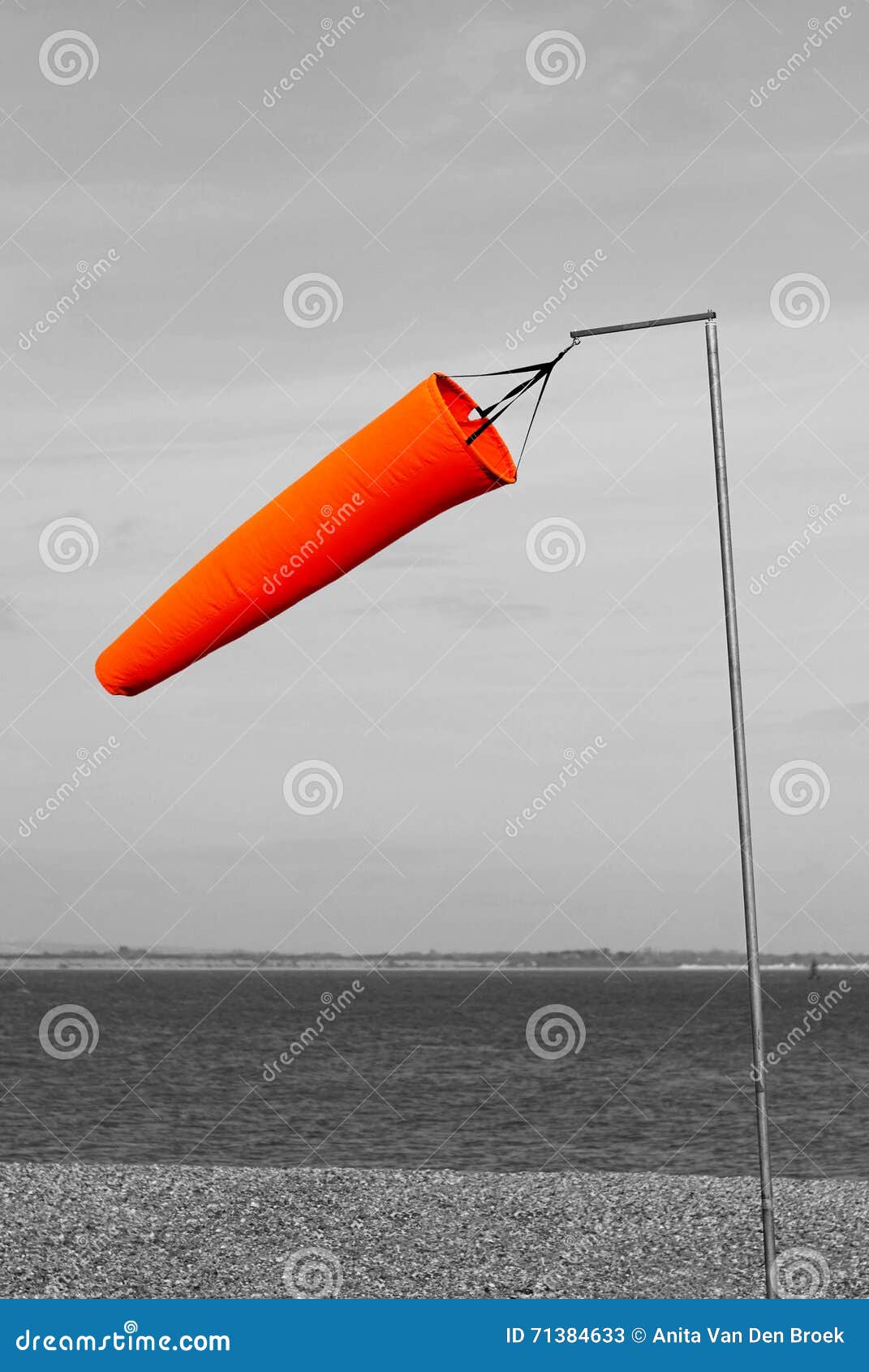 Orange Windsock by the Sea Blowing in the Wind in Black and White Stock ...