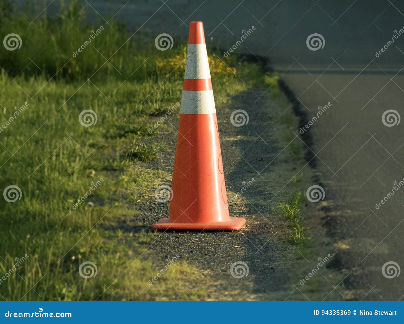 Orange Work Zone Cone on Side of Road Stock Image - Image of grass ...