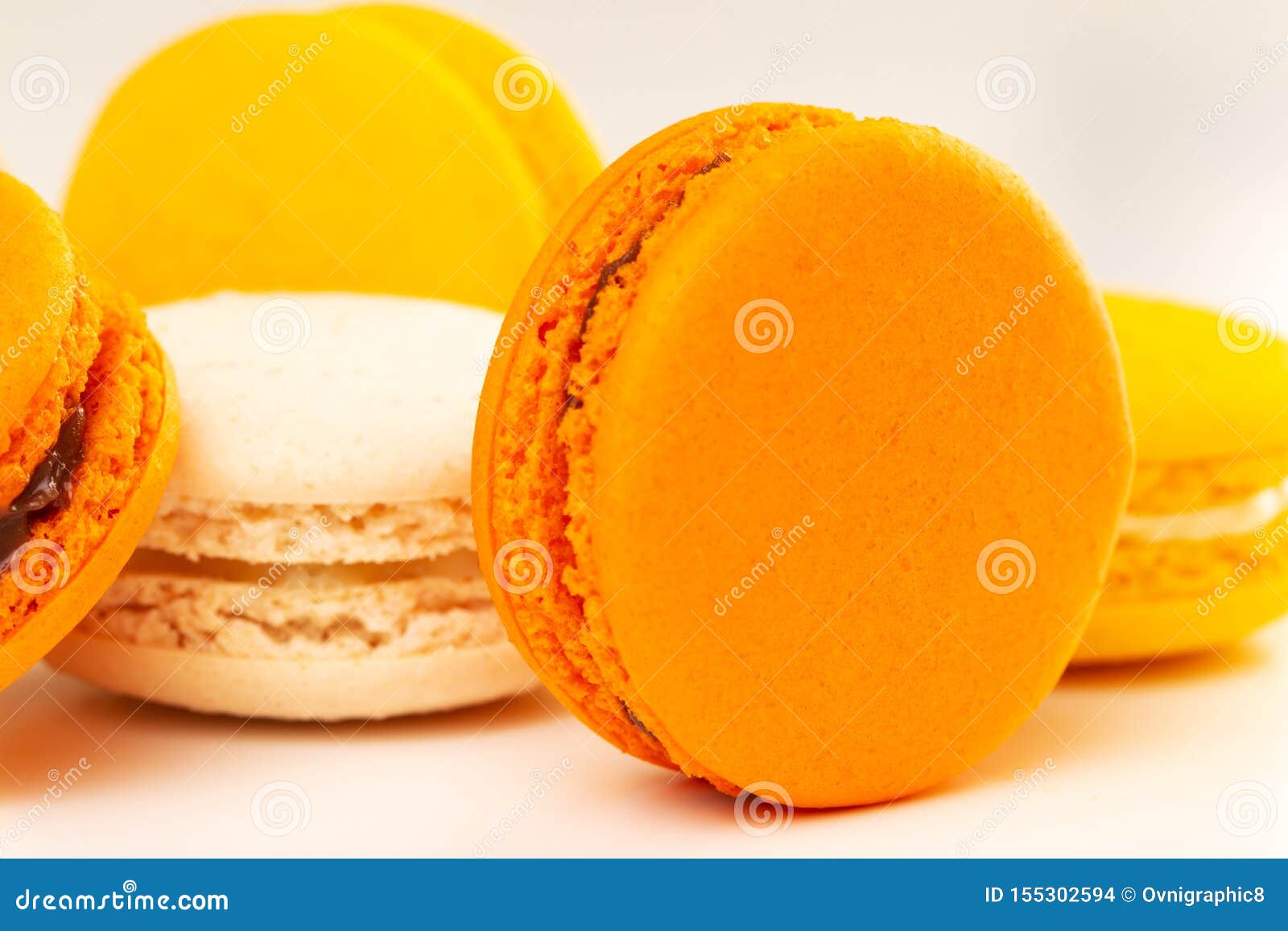Orange and Yellow Macarons or Macaroons Stacked. Closeup Stock Photo ...