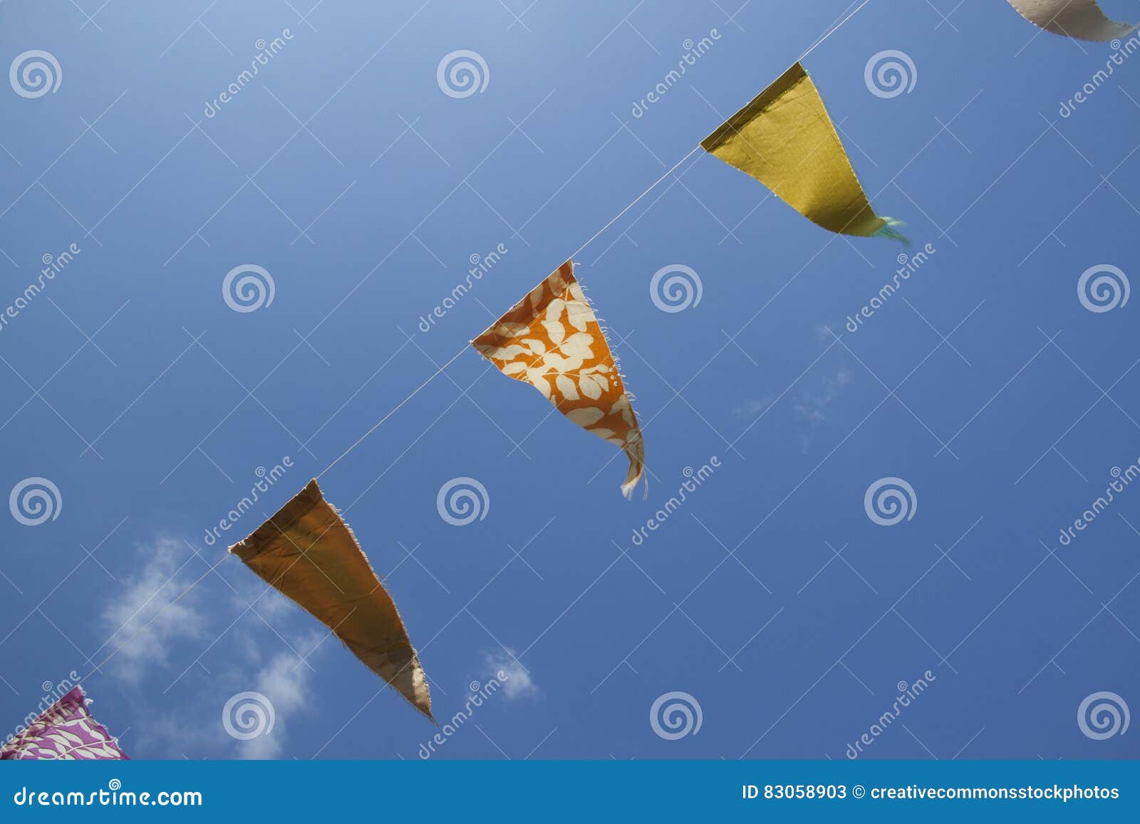 Orange Yellow And Red Flaglets Under Blue White Sky During Daytime ...