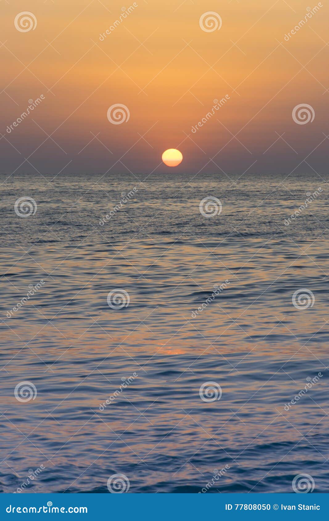 Orange Yellow Sun Sunsets Over Blue Clear Sky on the Open Sea 2 Stock ...