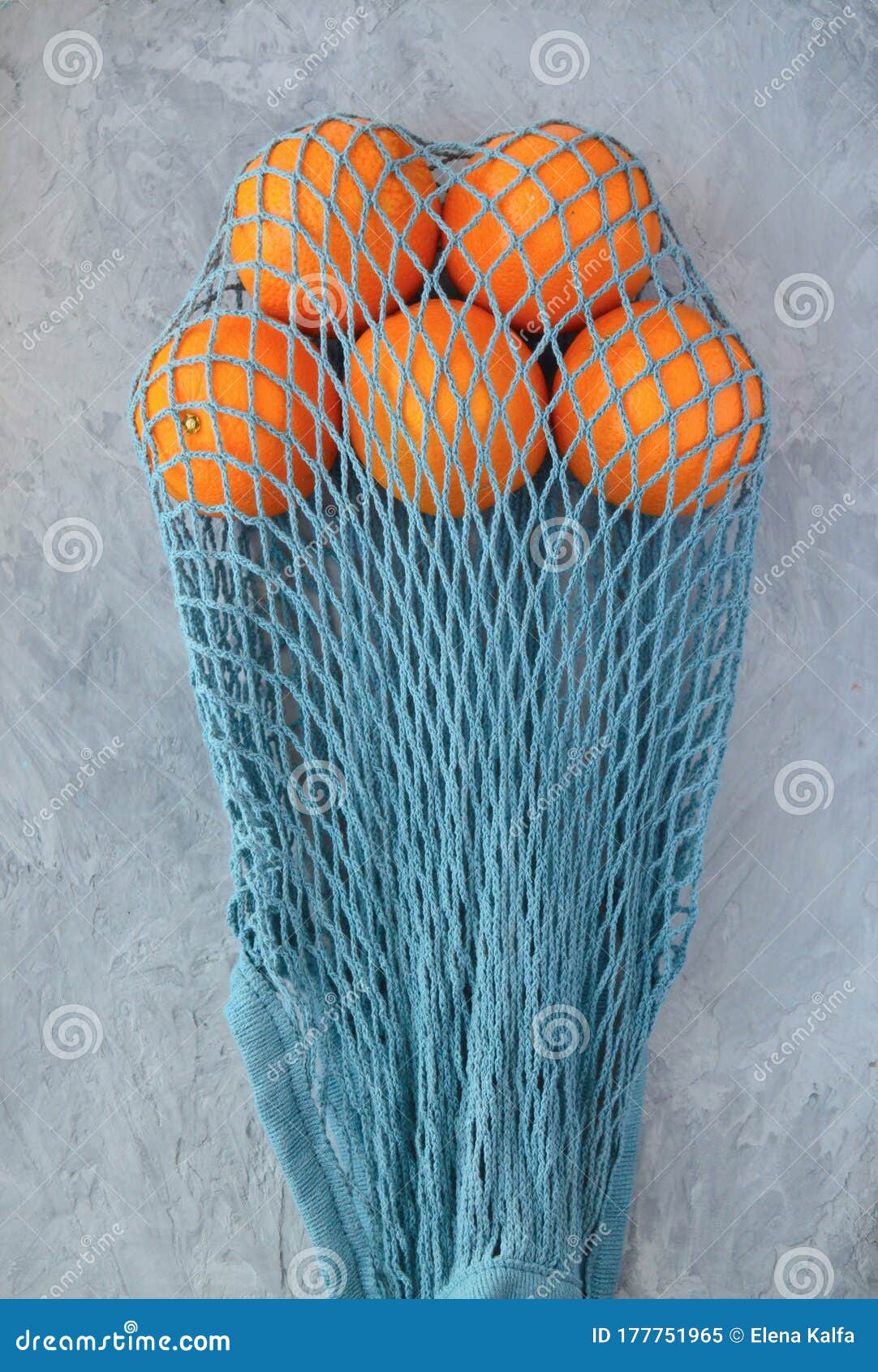 Oranges in Blue String Bag on Gray Background. Orange, Grapefruit ...