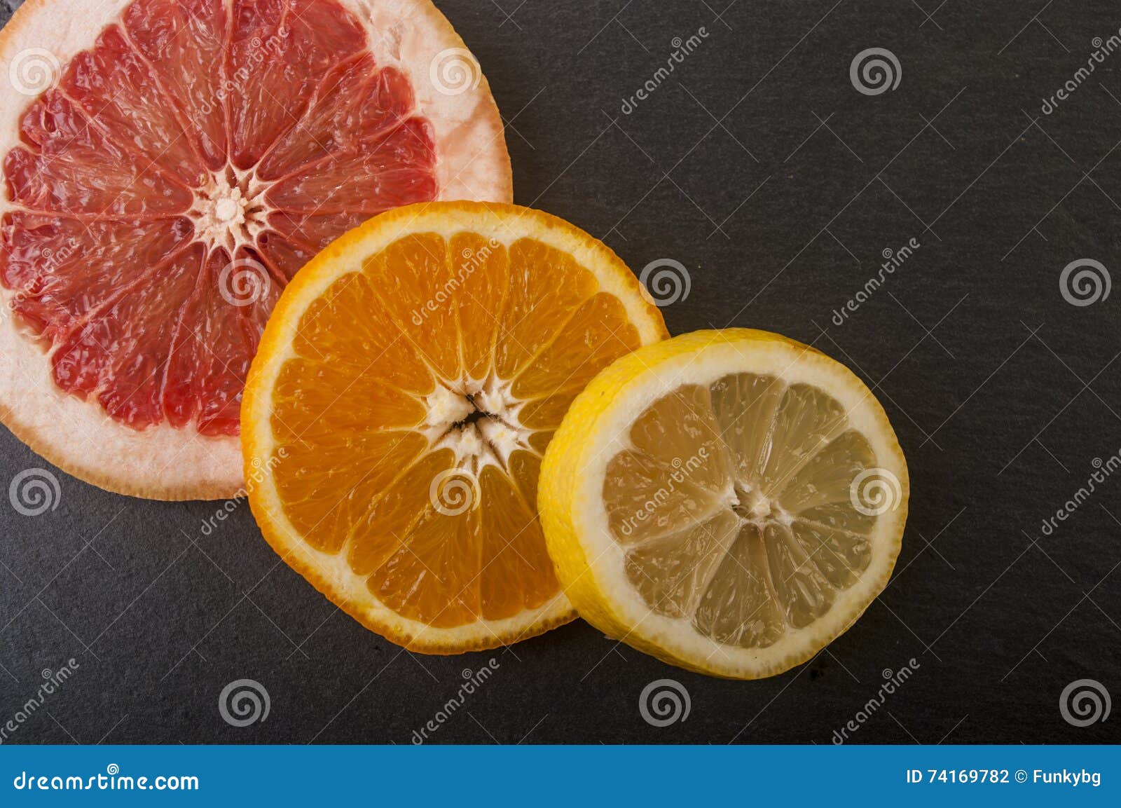 Oranges, Grapefruit ,lemon on a Black Background Stock Photo - Image of ...
