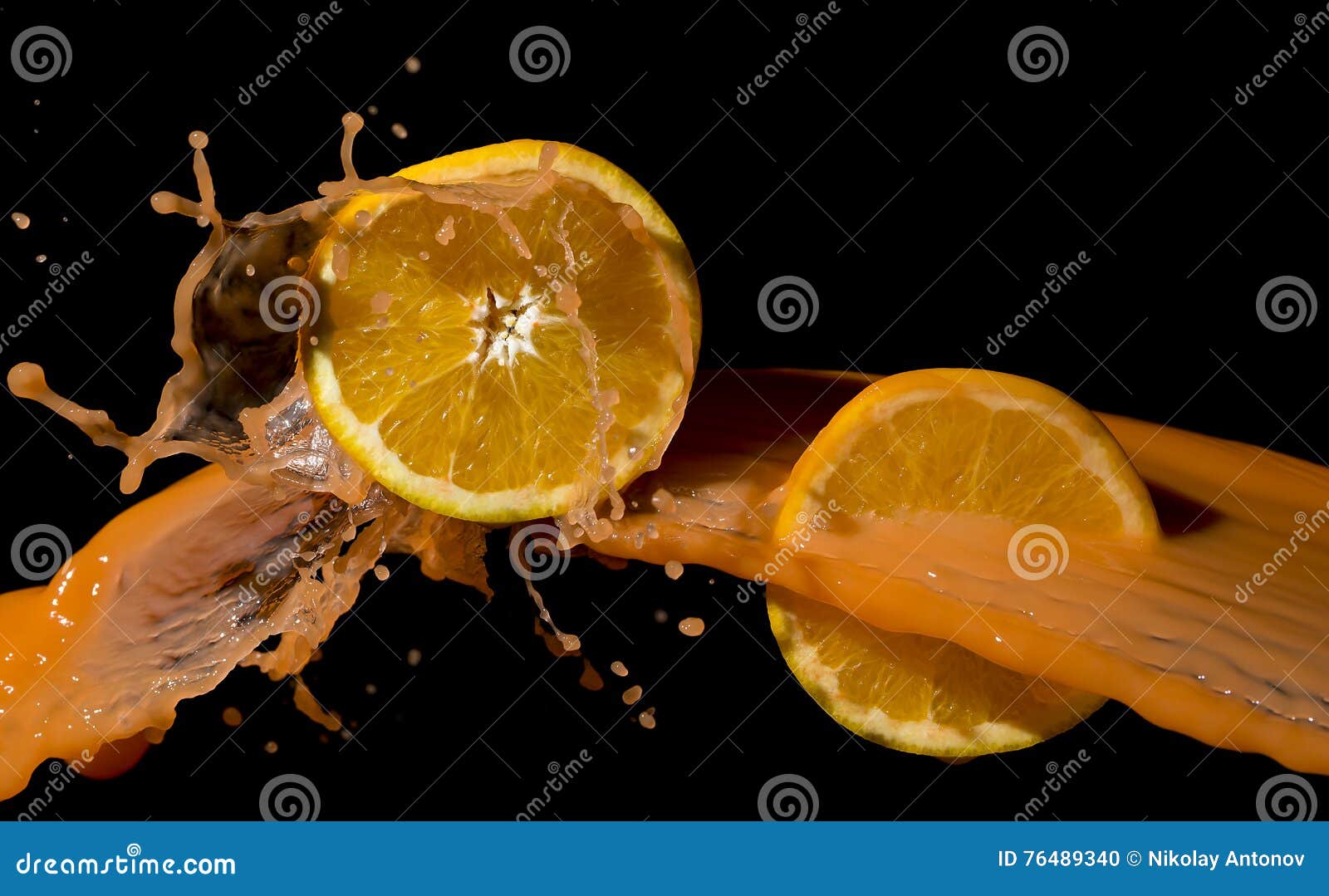 Oranges and Orange Juice Splash on a Black Background Stock Photo ...