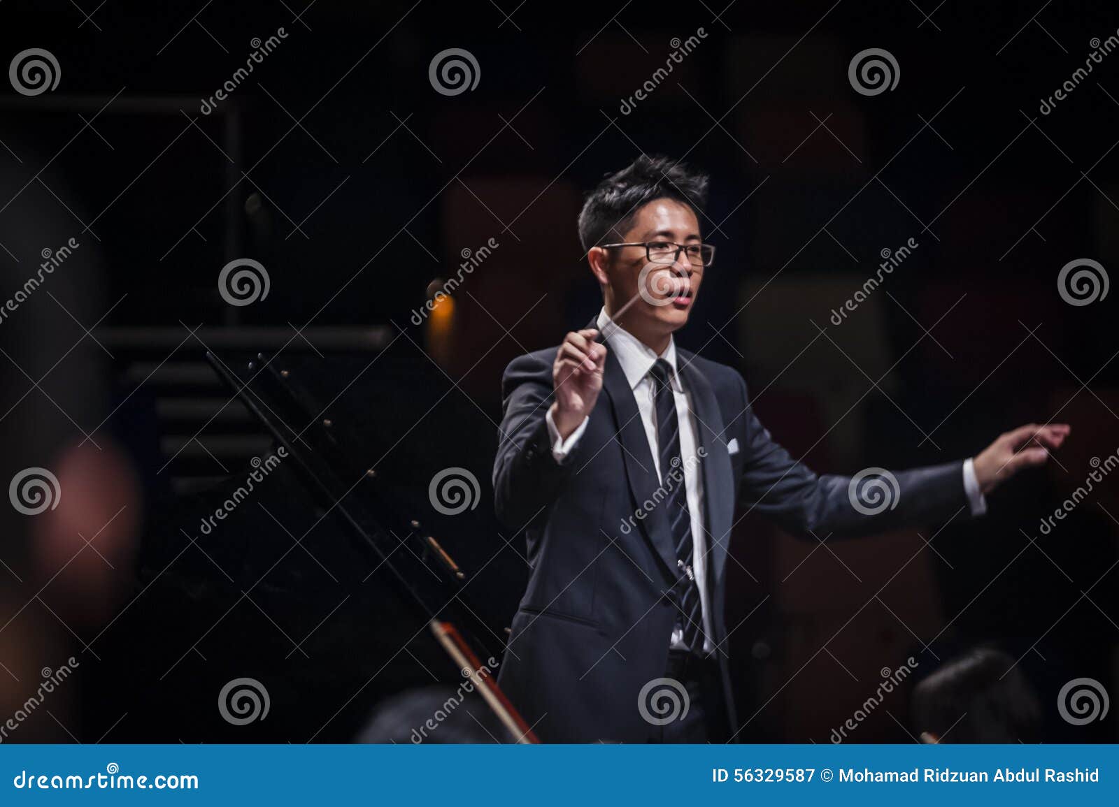 Orchestra Conductor editorial photography. Image of conductor - 56329587